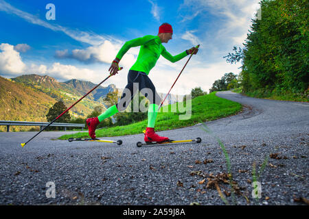 Training an athlete on the roller skaters. Biathlon ride on the roller ...