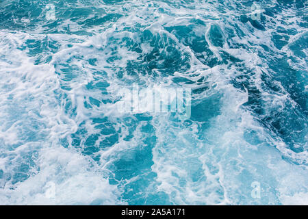 Turquoise sea surface background with splashing waves, top view Stock ...