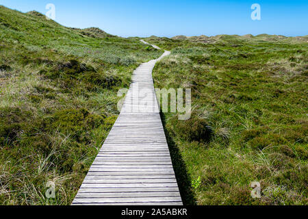 wooden bridge in a meadow, blue sky Stock Photo - Alamy