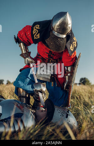 Knight put his sword to his opponent's throat Stock Photo - Alamy
