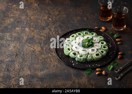 Turkish Delight. Assorted multi-colored oriental sweets with almonds on ...