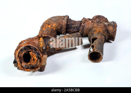 Fragments of old cast-iron water pipes. After many years of operation ...