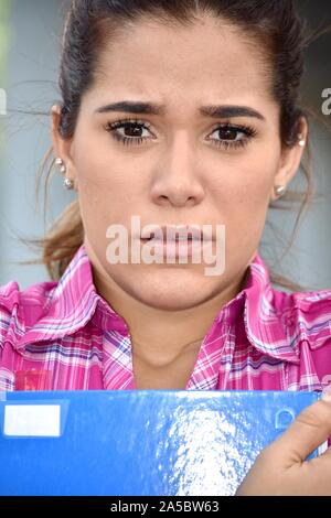 Fearful Female Student With Notebooks Stock Photo - Alamy