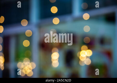 Festive bright blurred golden background. On Christmas black curtain ...
