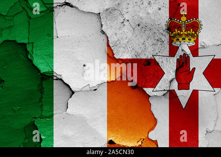National flag of Ireland against a background of a stone background ...
