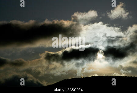 dark clouds covering the sun pollution global warming Stock Photo - Alamy