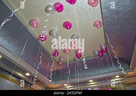 Balloons floating on the ceiling . Colorfull balloons float on the ...