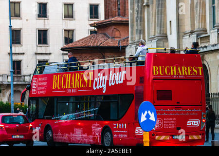 Touristic bus (Bucharest City Tour) with tourists in front of Central ...