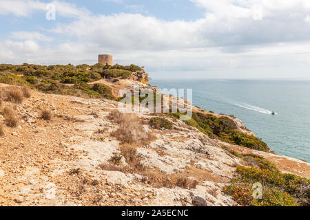 round watchtower on the cliffs above atlantic ocean on the algarve ...