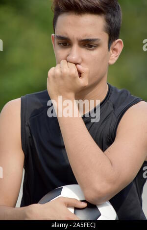 Athletic Male Soccer Player And Confusion Stock Photo - Alamy