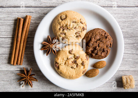 Tasty cookies with chocolate crumbles, anise stars spices, brown sugar ...