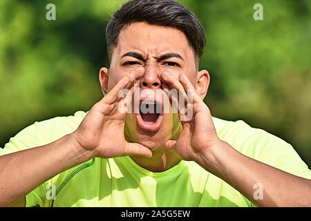 Male athlete yelling Stock Photo - Alamy