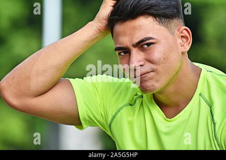 Confused Male Athlete Stock Photo - Alamy
