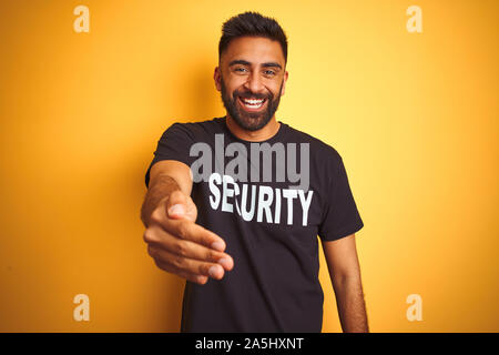 1 indian man Security Guard Handshake welcome Stock Photo - Alamy