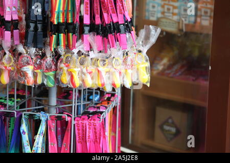A group of candy rock dummies on ribbons hanging in sweet shop store ...