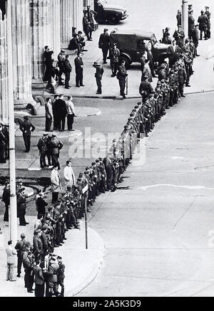 Soldiers line up in ranks and perform a 'Right Dress' as British army ...