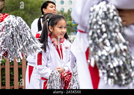 Young Chinese children rehearse cheerleading routines at Statue Square ...