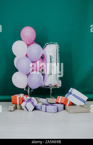balloons of different colors with gifts for the holiday Stock Photo - Alamy