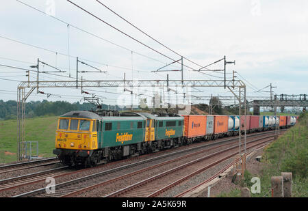 2 Freightliner class 86 electric locomotives making a silhouette at sun ...