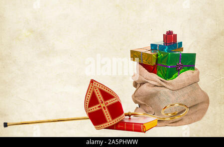 Mitre or miter sack with gifts and staff of saint nicholas. Isolated on ...