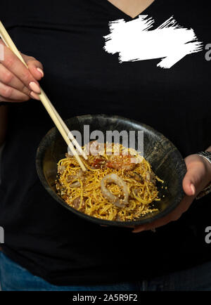 woman cooking noodles with seafood in home kitchen Stock Photo - Alamy
