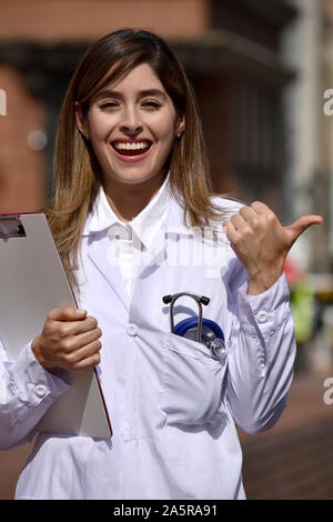 Cute Colombian Female Doctor Smiling With Clipboard Stock Photo - Alamy