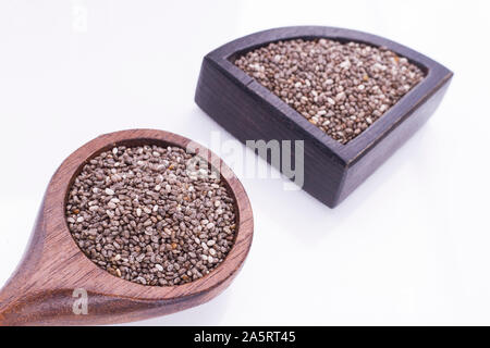 chia beans in container on white background Stock Photo - Alamy