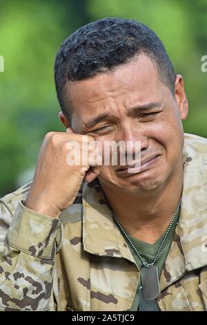 Crying, depression and sad military soldier with stress from the army ...
