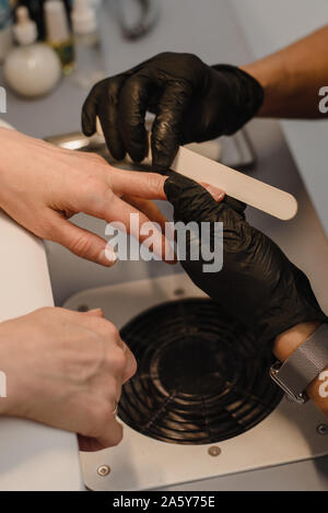 Girl filing nails Stock Photo - Alamy