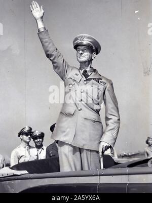 General Wainwright, standing in car, waving to crowd gathered at La ...