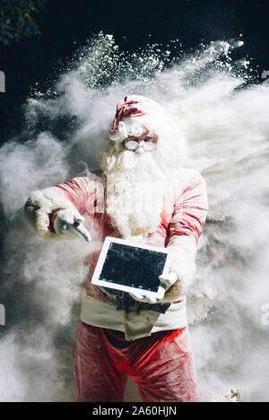 Santa Claus with digital tablet Stock Photo - Alamy