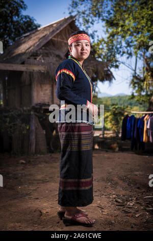 Khmu girls in traditional attire proudly pose in a rural village in ...