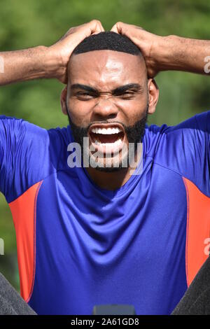 Stressed Male Athlete Stock Photo - Alamy