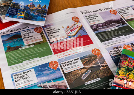 Travel section in daily newspaper. Printed holiday, vacation ...
