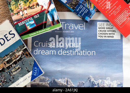 Travel section in daily newspaper. Printed holiday, vacation ...