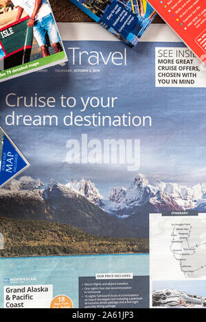 Travel section in daily newspaper. Printed holiday, vacation ...