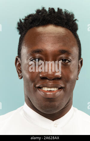 African-american young man's portrait on purple color studio background ...