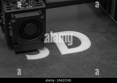 3D printer prints the word 3D with white filament PLA Stock Photo - Alamy