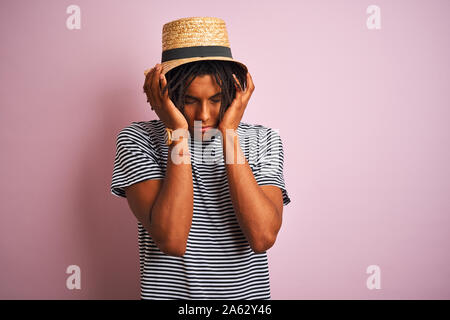 Afro man with dreadlocks wearing navy striped t-shirt standing over ...