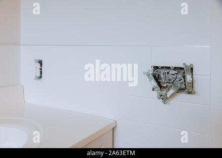 Work on installing electrical outlets with electrical wires and ...