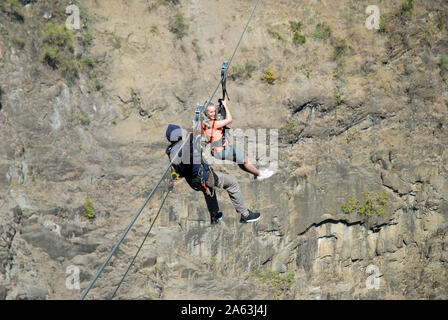 Zipline from the Victoria Falls Bridge over the Zambezi River, Zimbabwe ...