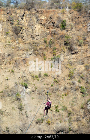 Zipline from the Victoria Falls Bridge over the Zambezi River, Zimbabwe ...