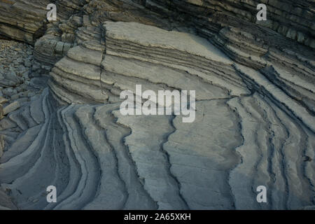 Beach with stacked limestone strata in Ceredigion, Wales,UK Stock Photo ...