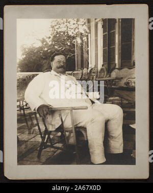 William H. Taft, Governor-General of the Philippines, seated at desk in ...