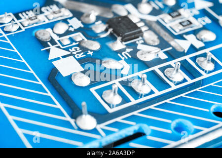 Macro shot of a Circuitboard with resistors microchips and electronic ...