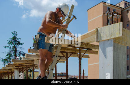 concrete work: workers carpenters preparing construction formwork for ...