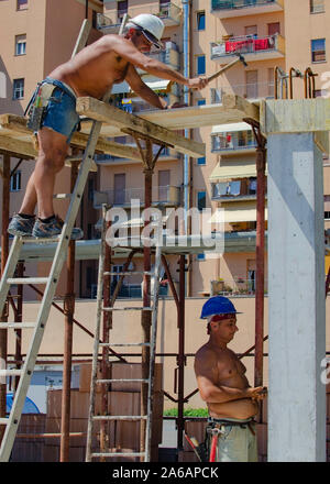 concrete work: workers carpenters preparing construction formwork for ...