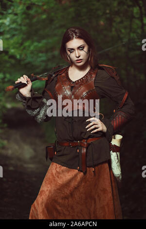 Beautiful female fighter with a sword Stock Photo - Alamy
