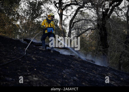 A firefighter works on a wild fire burning in West Kelowna, B.C ...