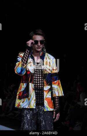 Jakarta, Indonesia. 25th Oct, 2019. A model presents a creation of Maya ...